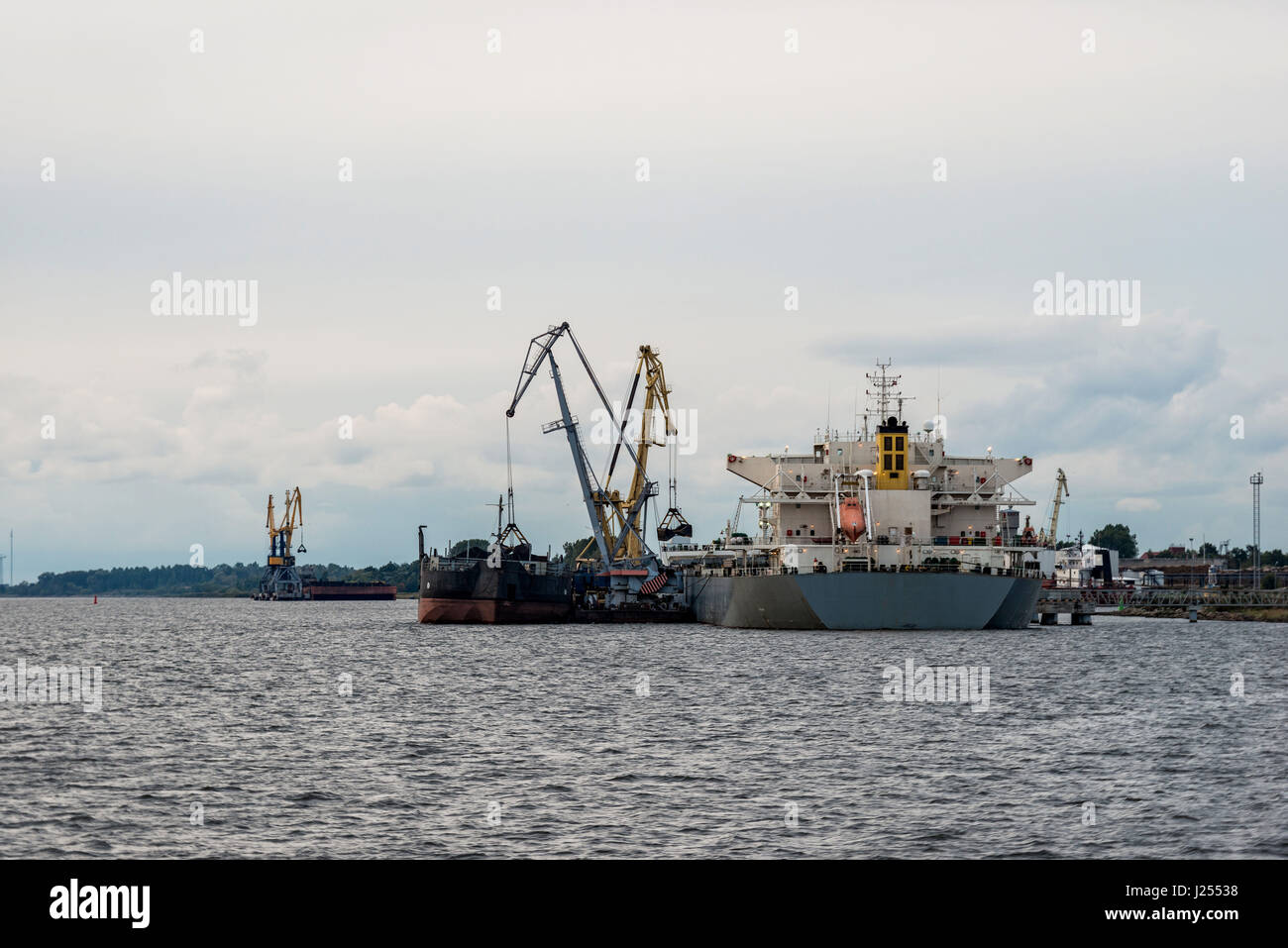 Ship transshipment of the port channel Stock Photo - Alamy