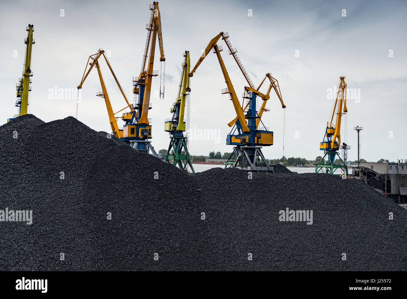 Work in port coal transshipment terminal Stock Photo - Alamy
