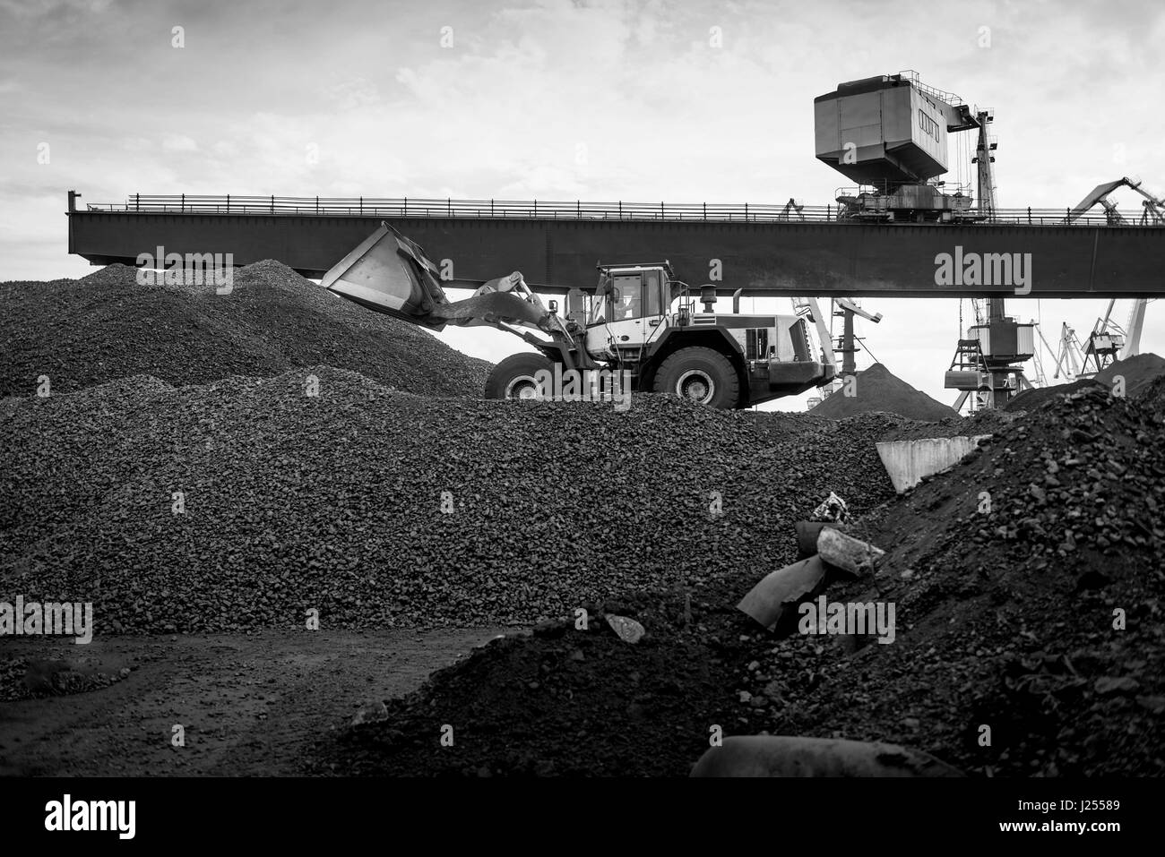 Work in port coal transshipment terminal Stock Photo - Alamy