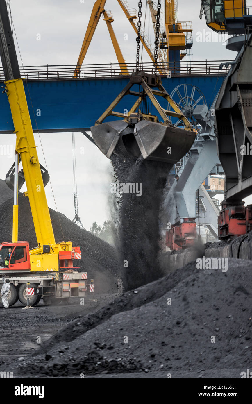 Work in port coal transshipment terminal Stock Photo - Alamy