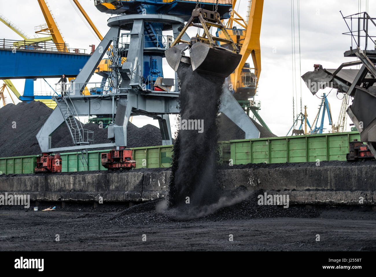 Work in port coal transshipment terminal Stock Photo - Alamy