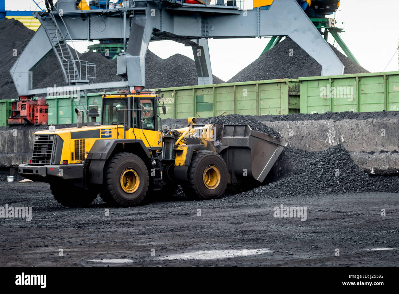 Work in port coal transshipment terminal Stock Photo - Alamy