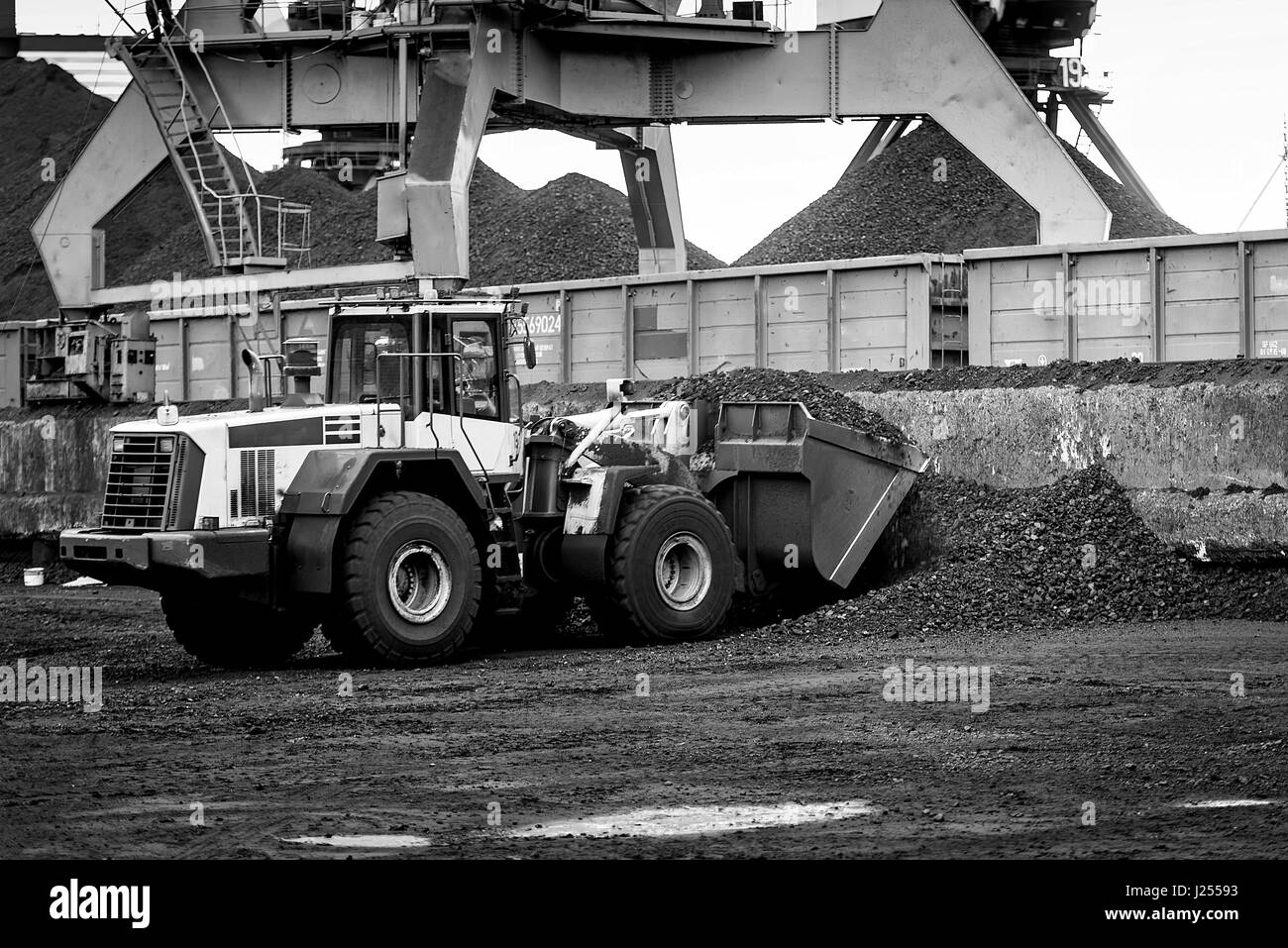 Work in port coal transshipment terminal Stock Photo - Alamy
