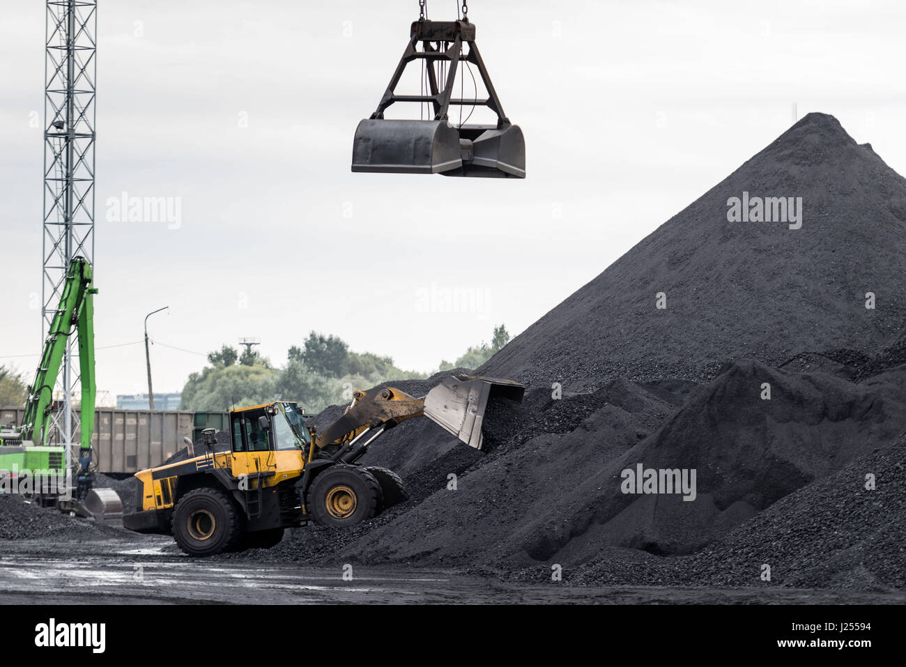 Work in port coal transshipment terminal Stock Photo - Alamy