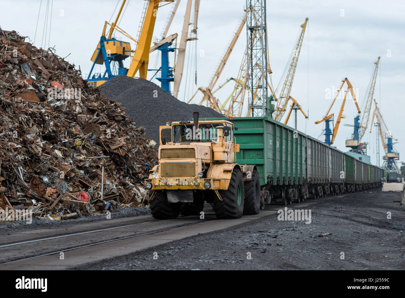 Work in port coal transshipment terminal Stock Photo - Alamy