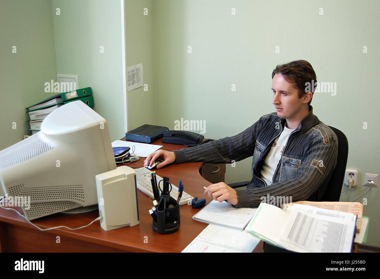Business man in office Stock Photo - Alamy