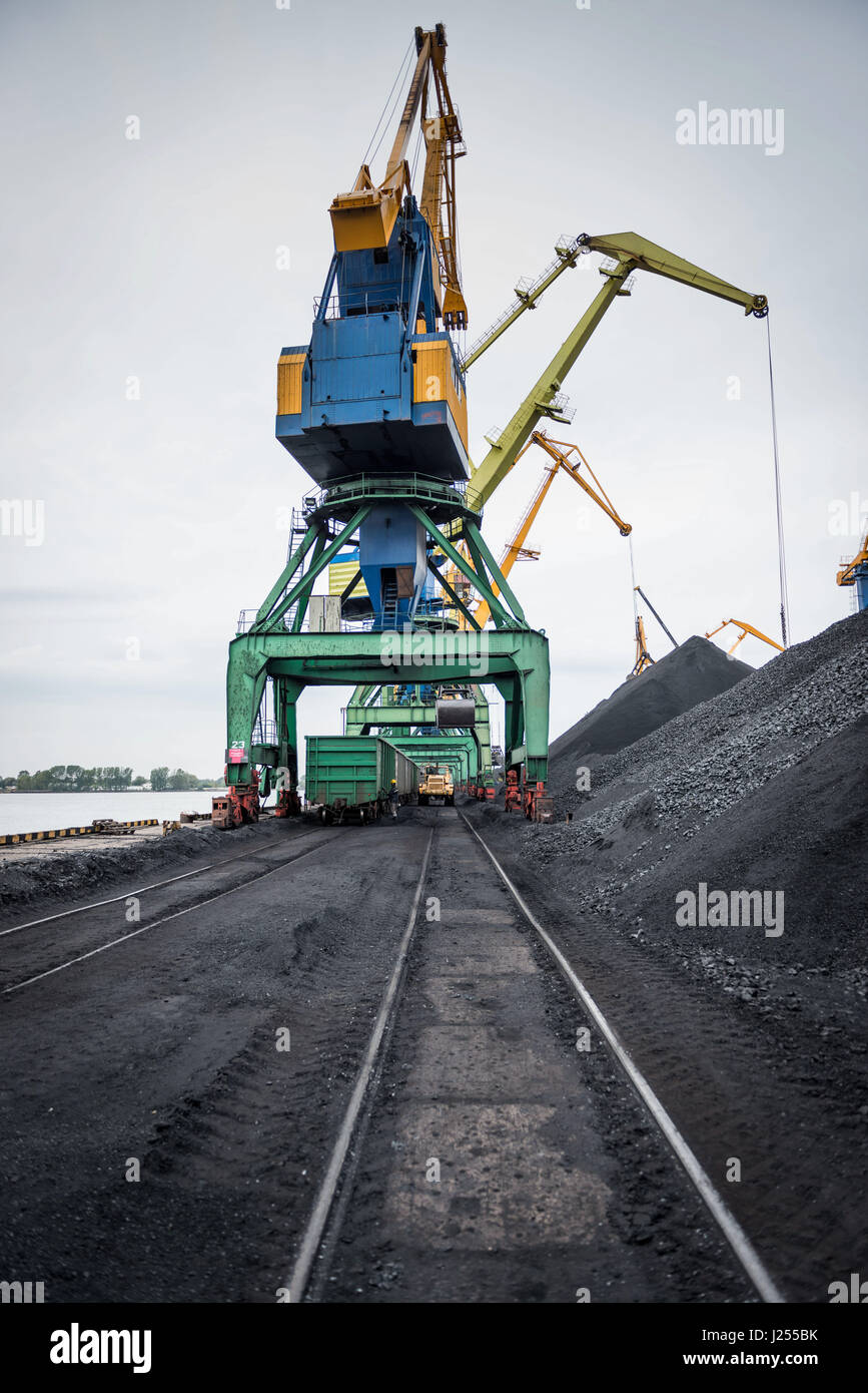 Work in port coal handling terminal Stock Photo - Alamy