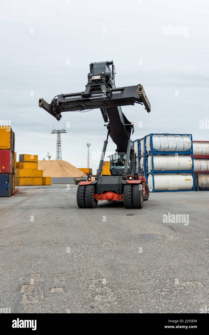 Mobile stacker handler in action at a container terminal Stock Photo ...
