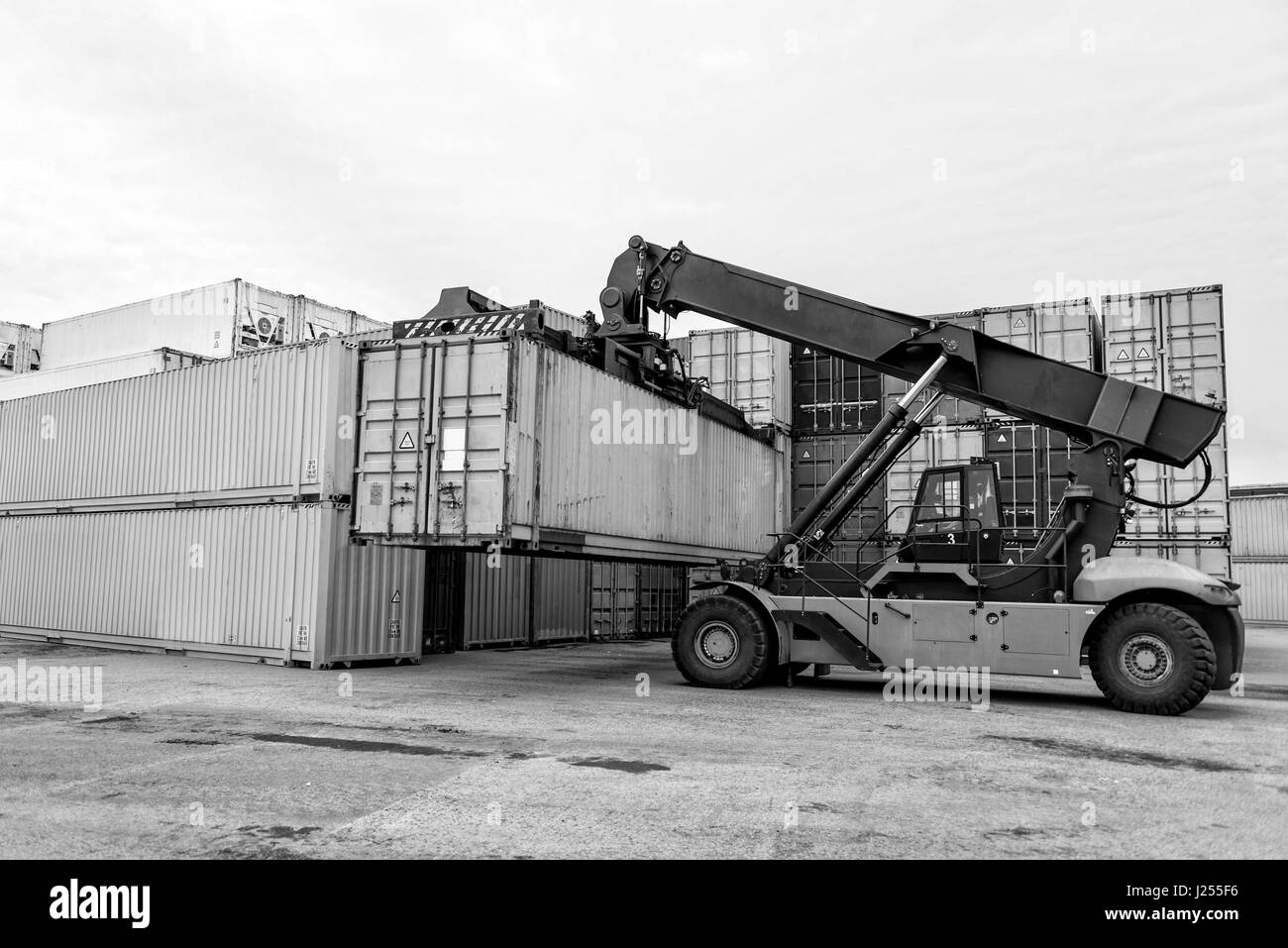 Mobile stacker handler in action at a container terminal Stock Photo ...