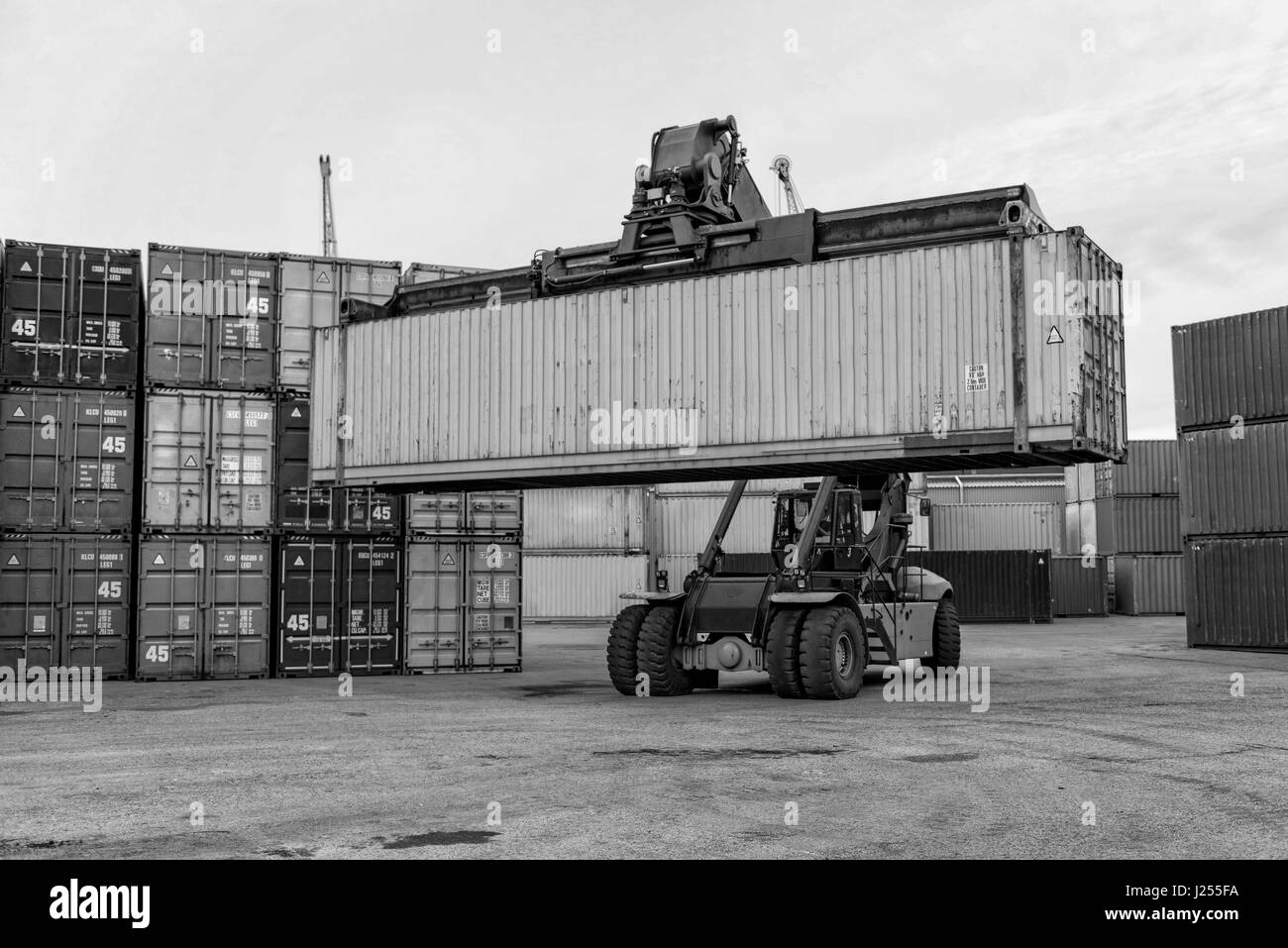 Mobile stacker handler in action at a container terminal Stock Photo ...