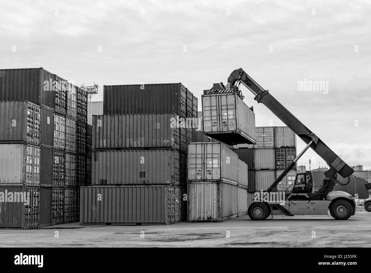 Mobile stacker handler in action at a container terminal Stock Photo ...
