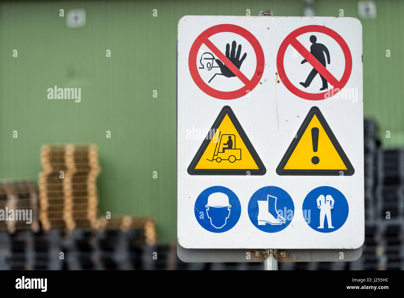 Signs warn of job security. Sign 'dangerous cargo' Stock Photo - Alamy