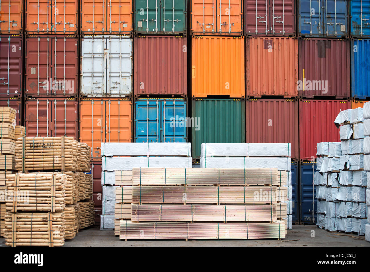 Containers and neatly stacked timber stock Stock Photo - Alamy