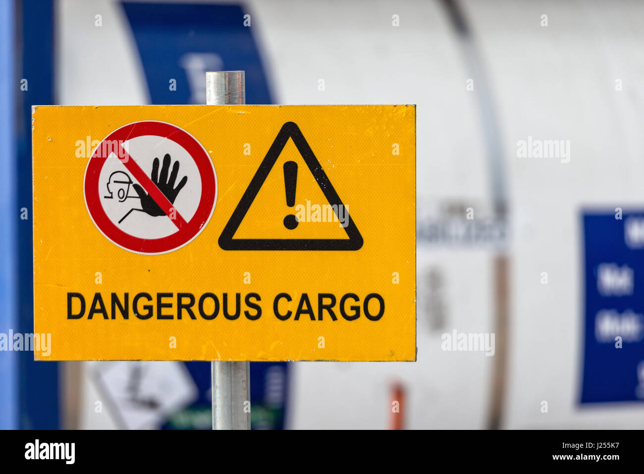 Signs warn of job security. Sign 'dangerous cargo' Stock Photo - Alamy