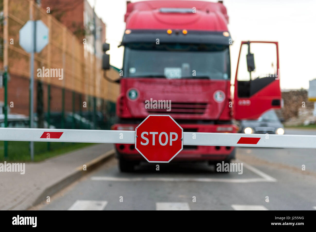 Truck standing at the barrier with a STOP sign Stock Photo - Alamy