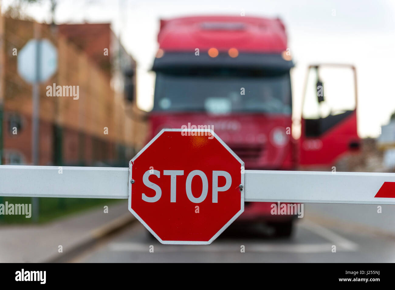 Truck standing at the barrier with a STOP sign Stock Photo - Alamy