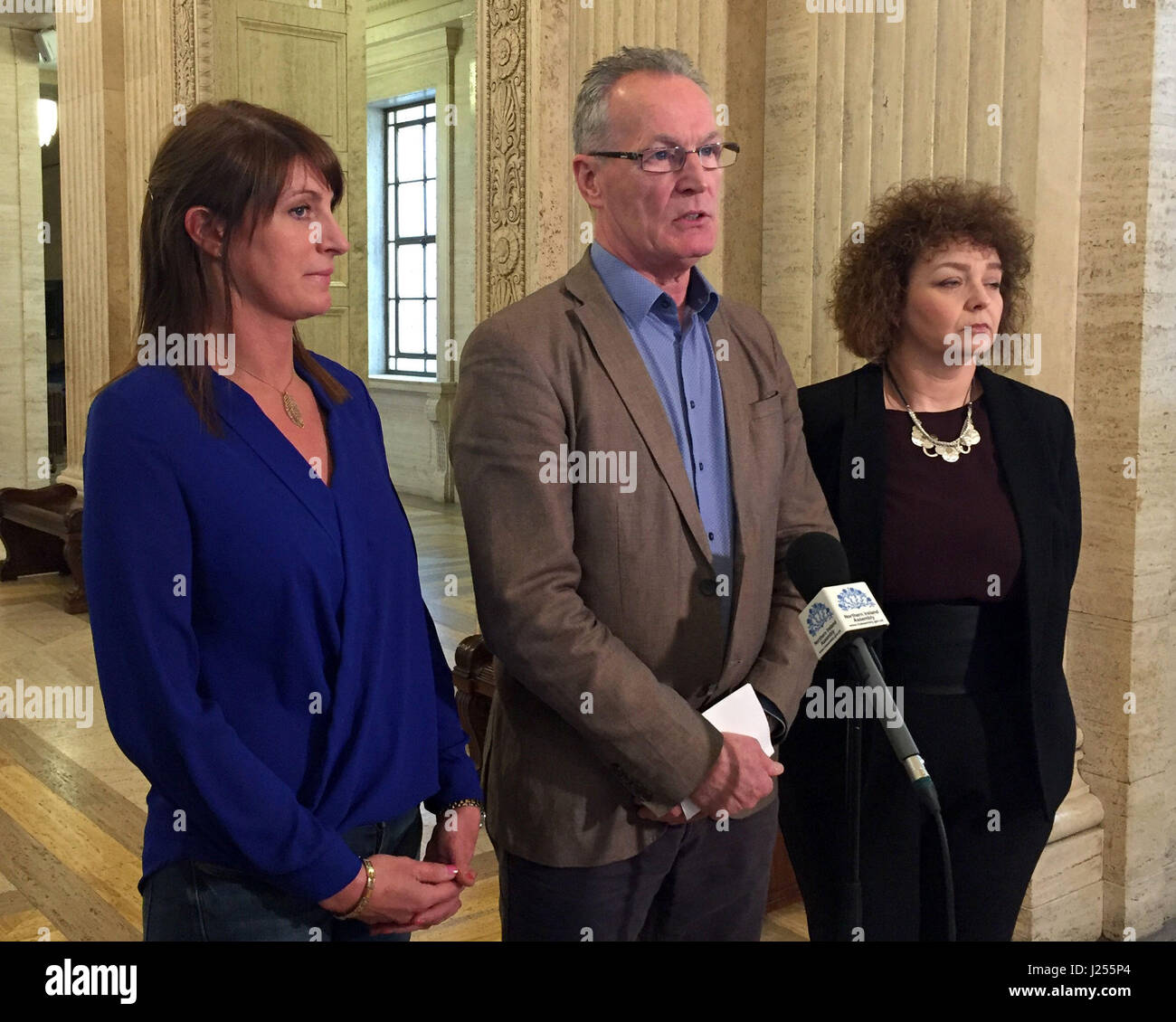 Sinn Fein's Gerry Kelly (centre), flanked by party colleagues, as he ...