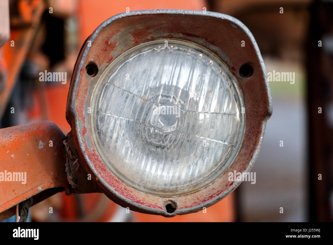 A close up of a headlight of an old rusty tractor Stock Photo - Alamy