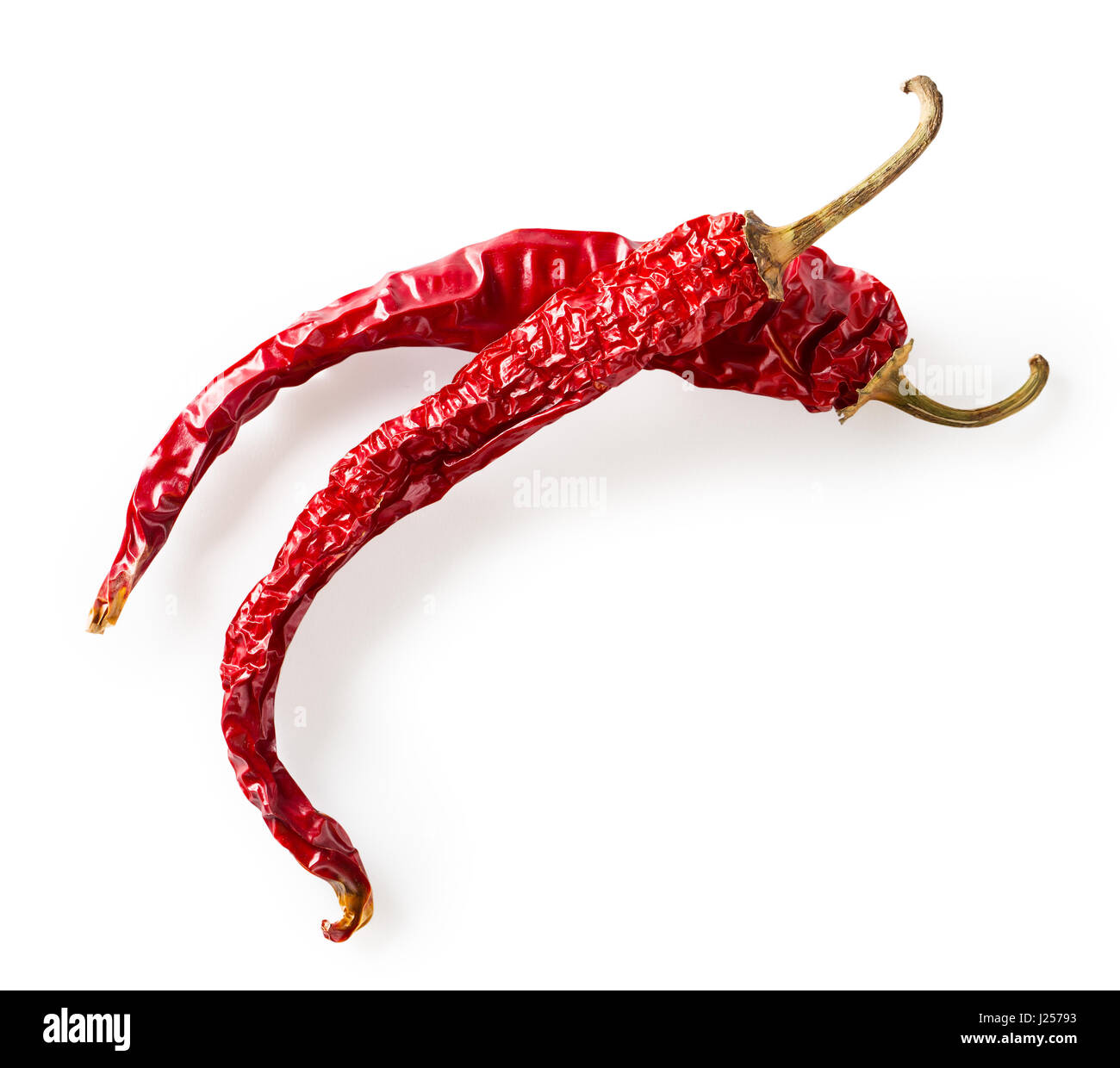 Two red dry sharp peppers isolated on white background Stock Photo - Alamy