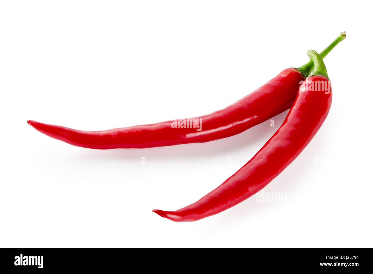 Two red peppers isolated on white background Stock Photo - Alamy