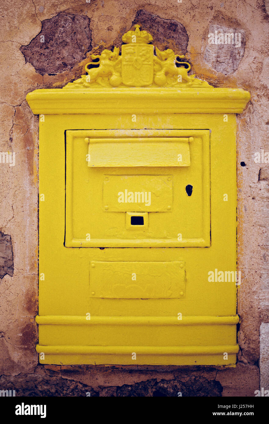 Yellow letter box in Spain Stock Photo - Alamy