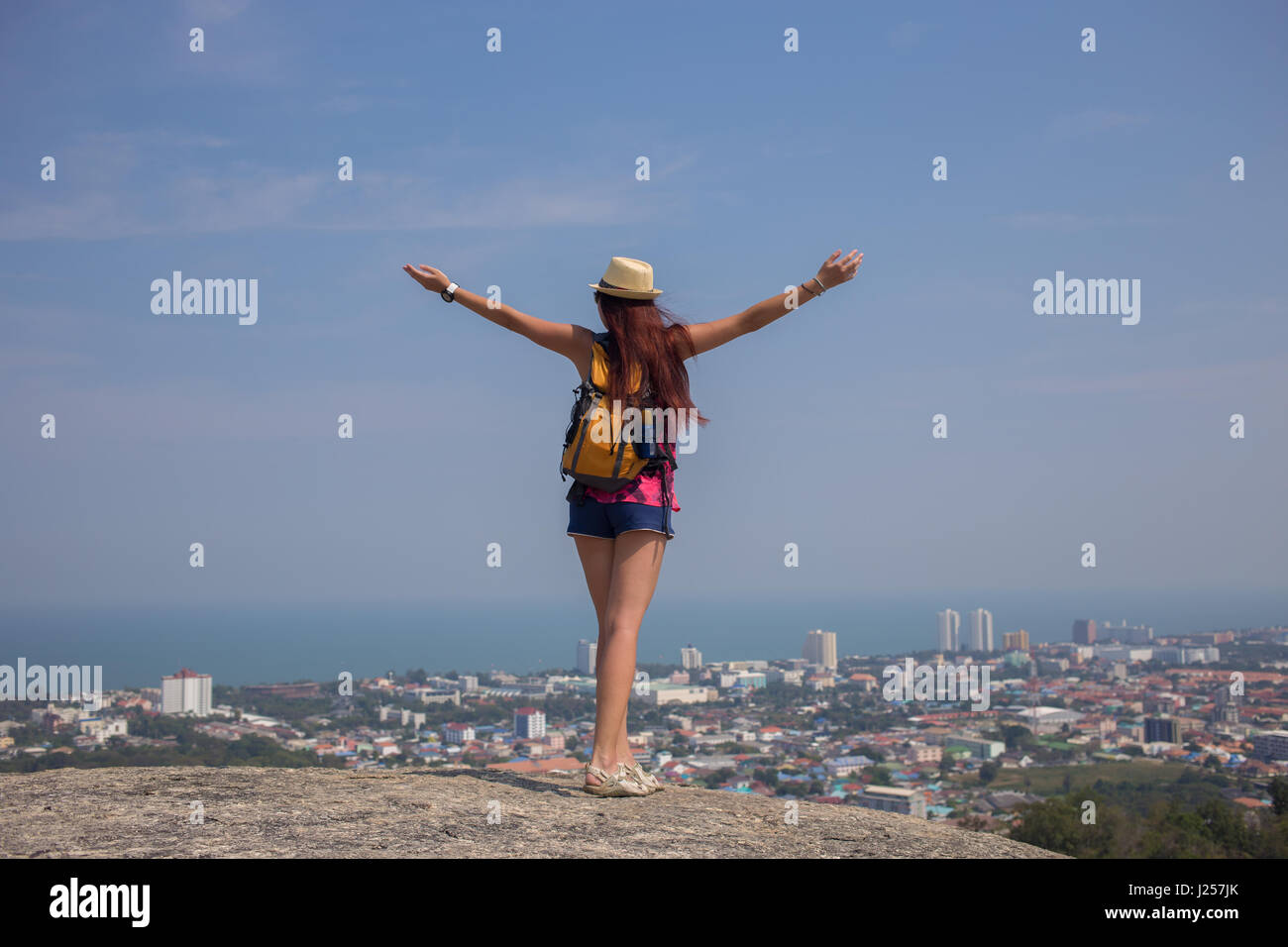 Girl standing with hands up Stock Photo - Alamy