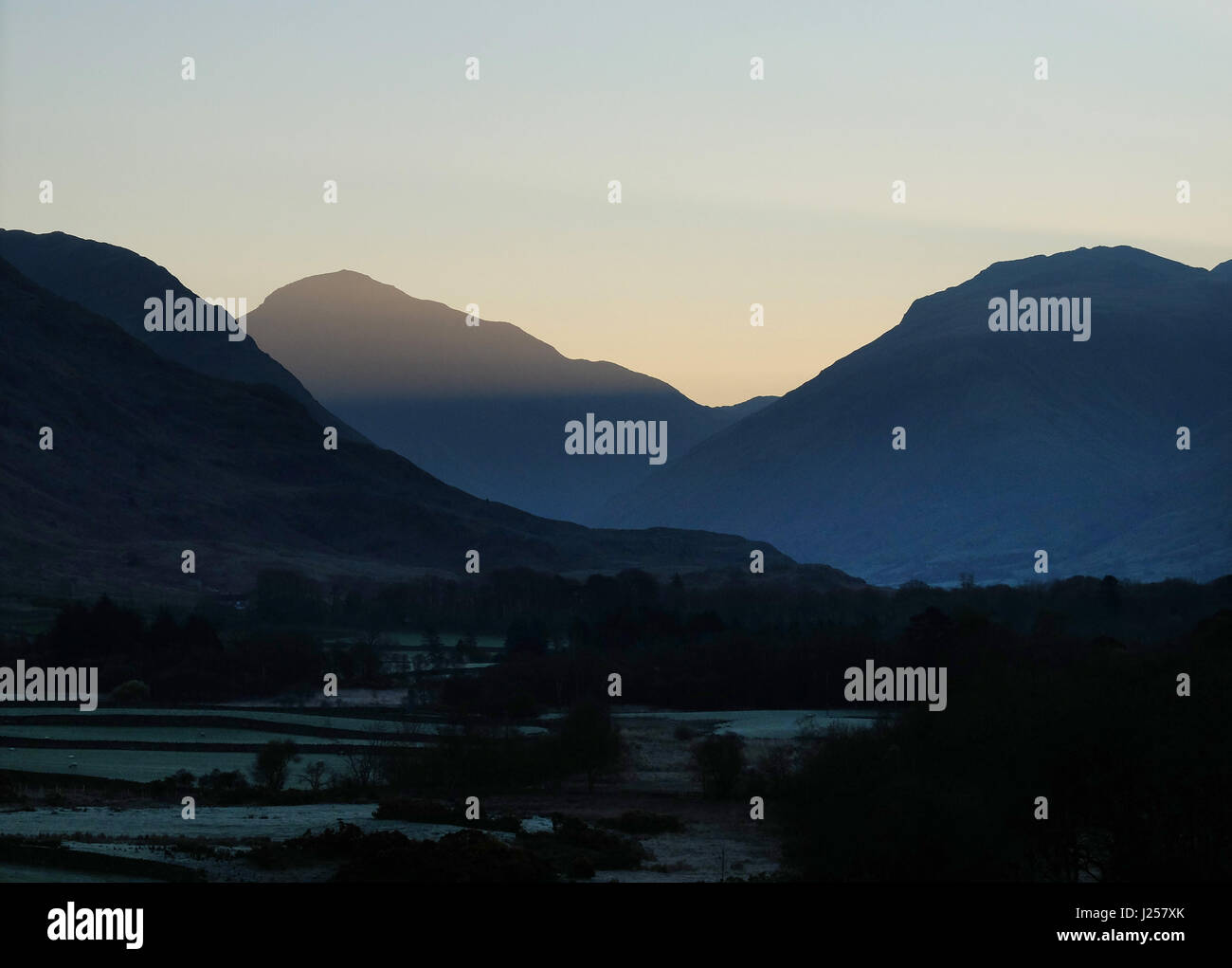 Sun rising on a frosty spring morning in the Englsh Lake District ...