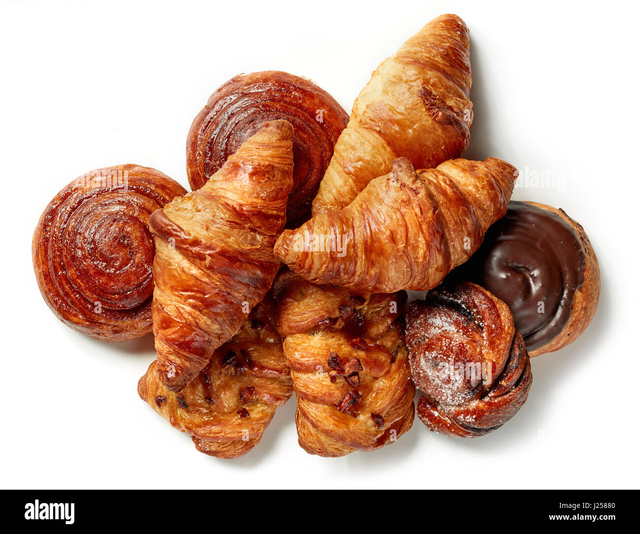 various freshly baked pastries isolated on white background, top view ...