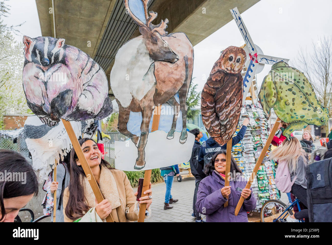 Women with endangered species signs, Earth Day Parade and Festival ...