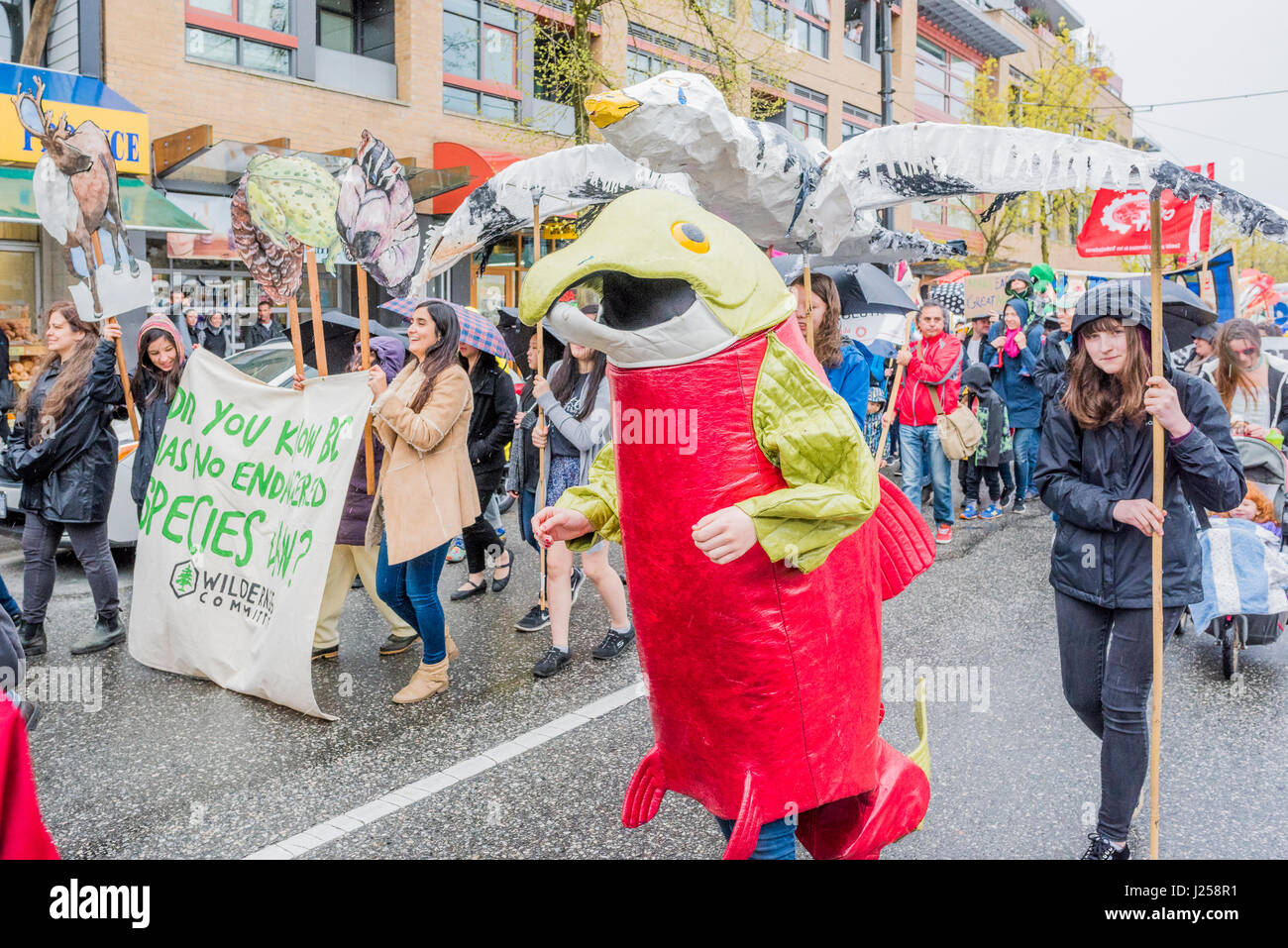 Women with endangered species signs, Earth Day Parade and Festival ...