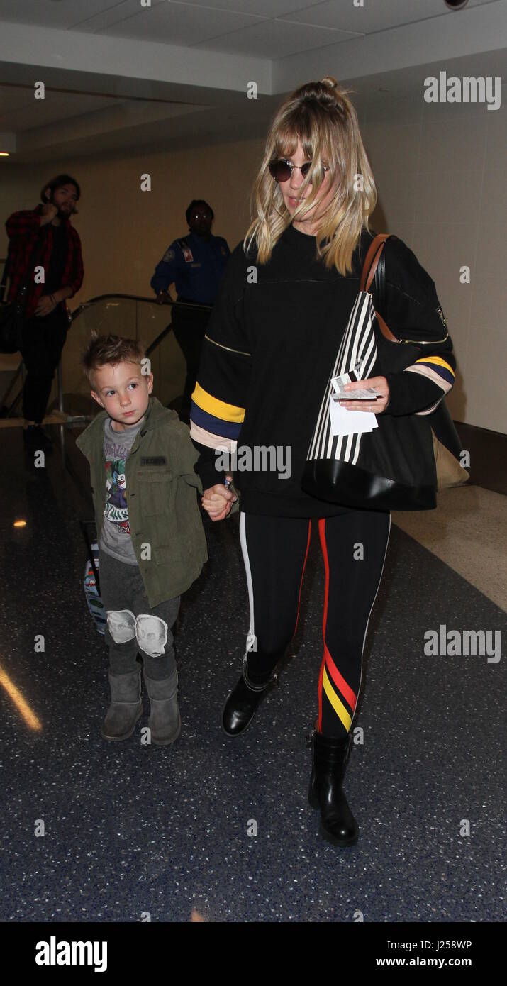 January Jones departs from the airport with her son Xander Dane Jones ...