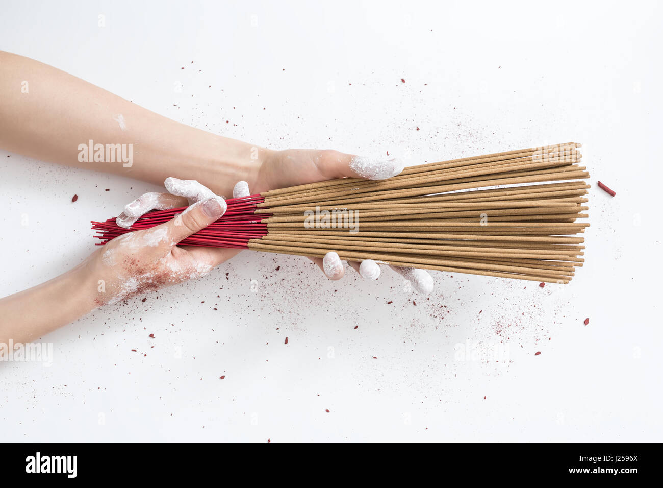 Aroma sticks in hands in powder Stock Photo - Alamy