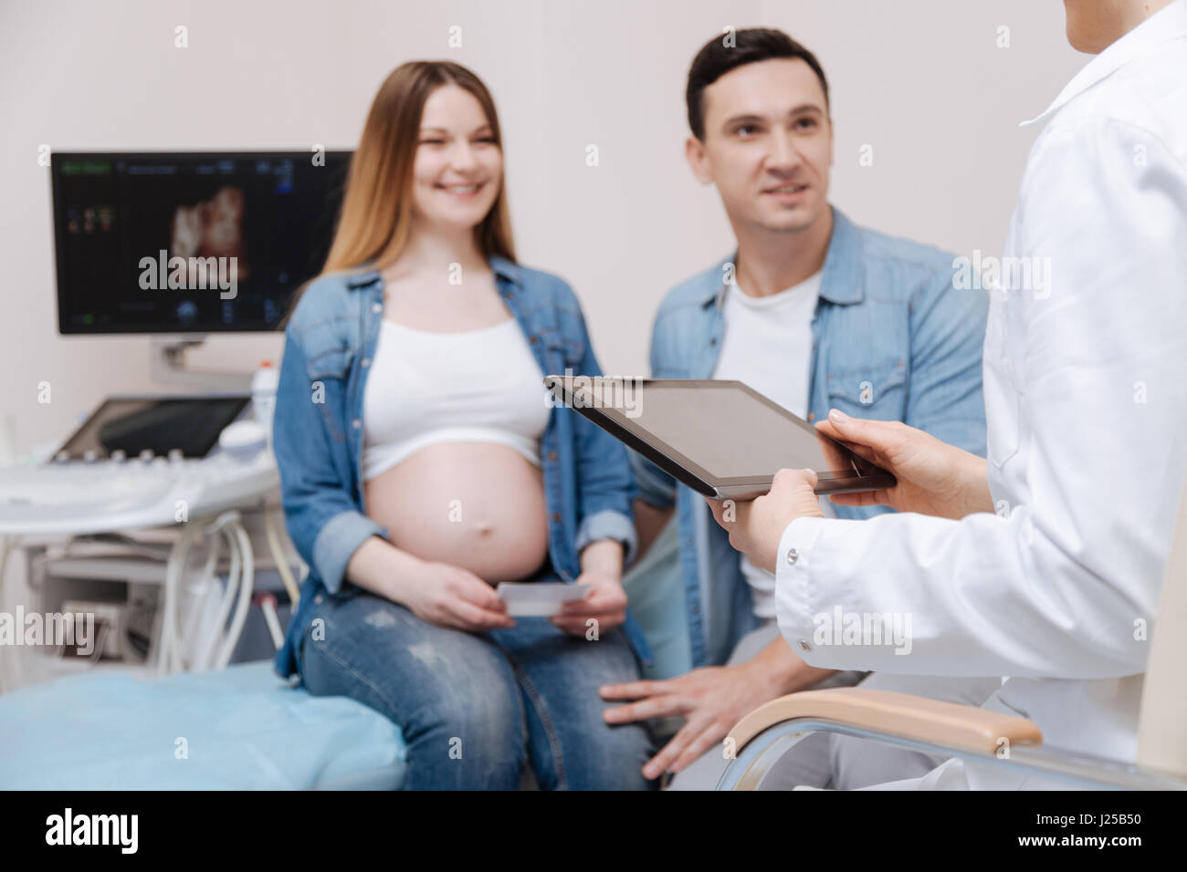 Professional doctor using modern gadget in the clinic Stock Photo - Alamy