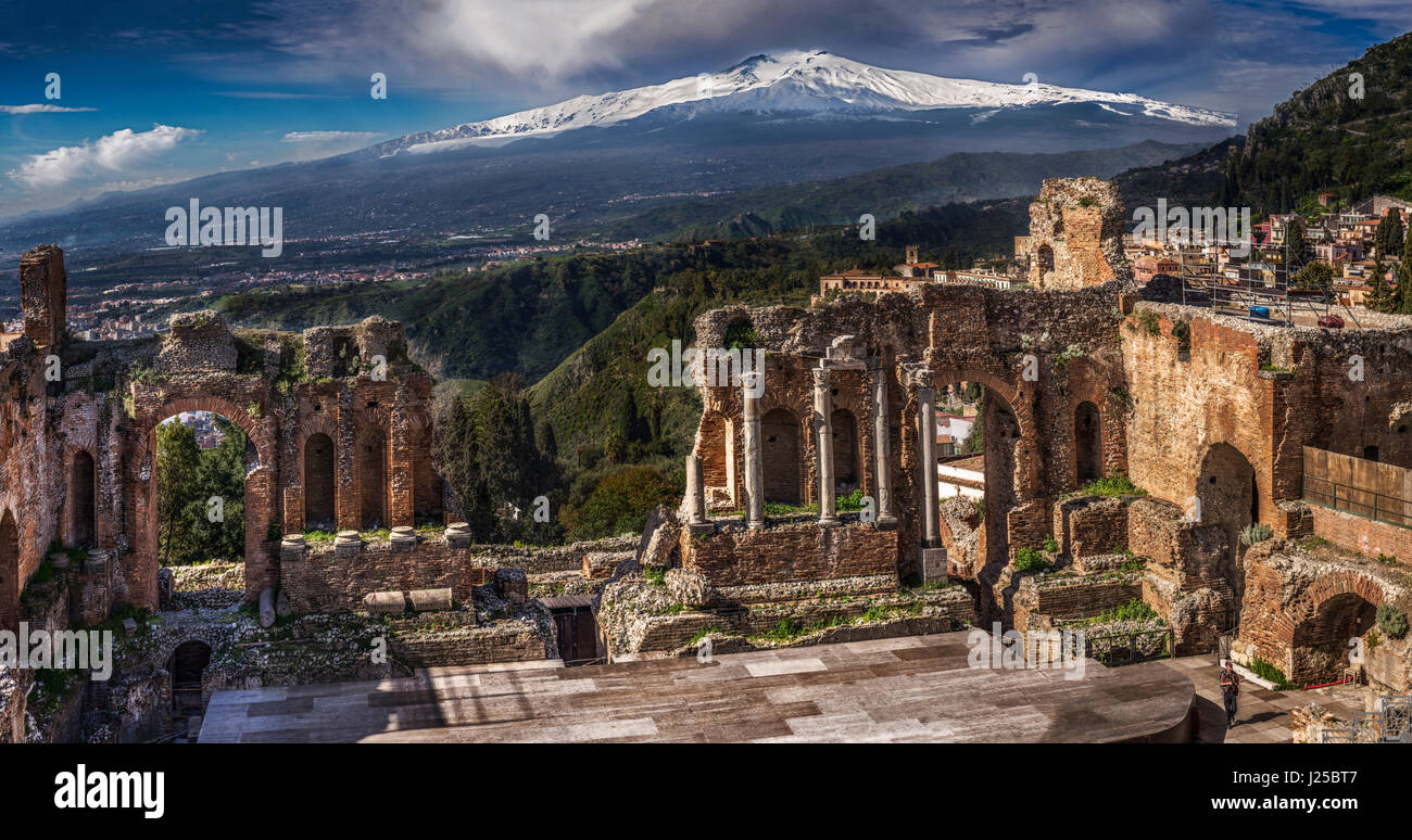 Italy, Sicily, Taormina, ruins of Teatro Greco with Mount Etna in the ...