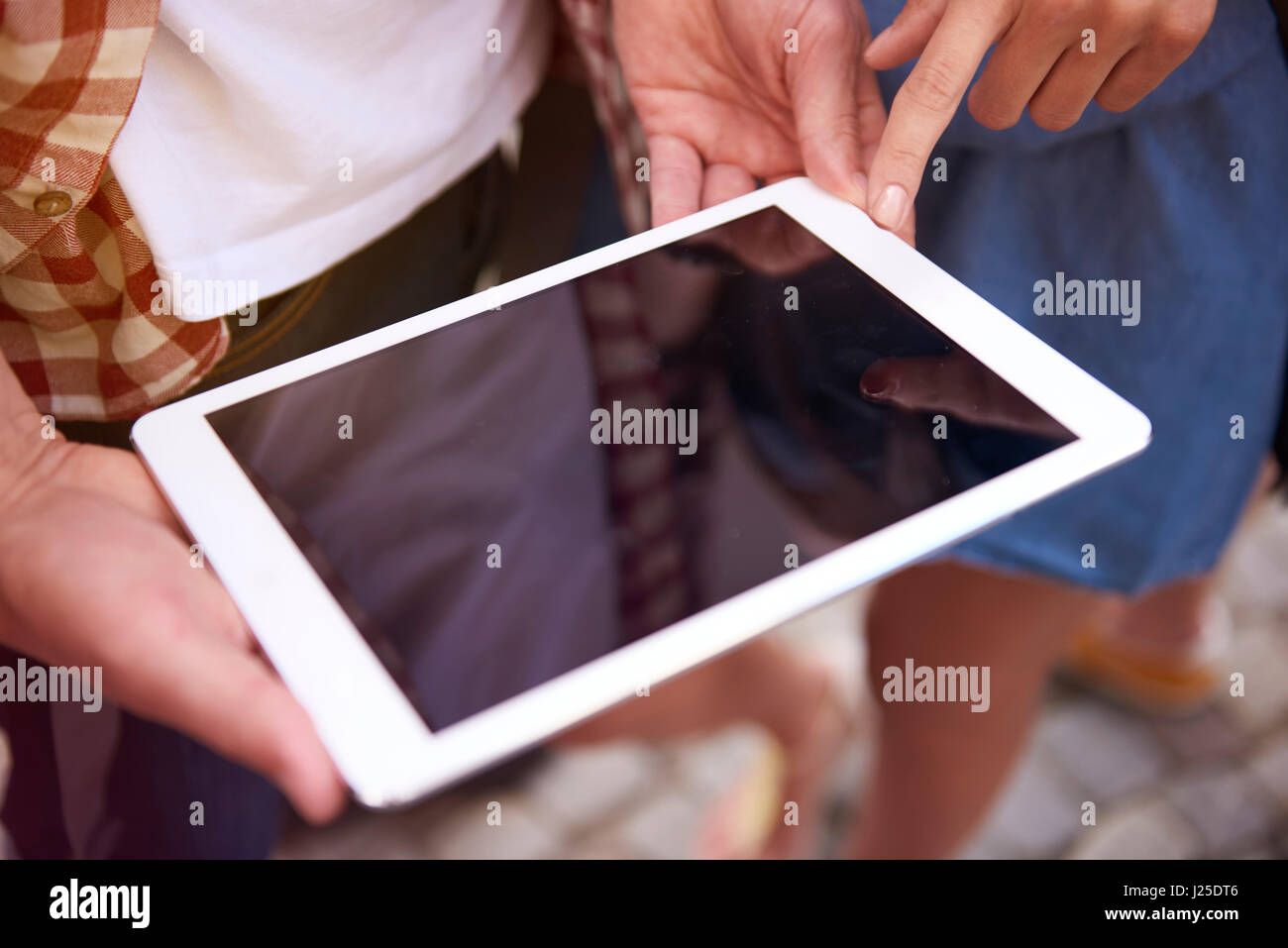Taking pictures their digital tablet hi-res stock photography and ...