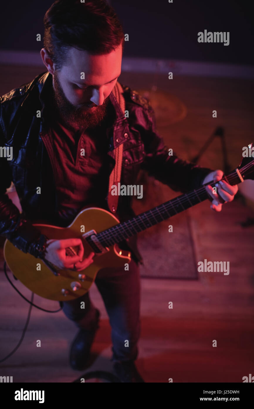 Close-up of guitarist playing electric guitar in recording studio Stock ...
