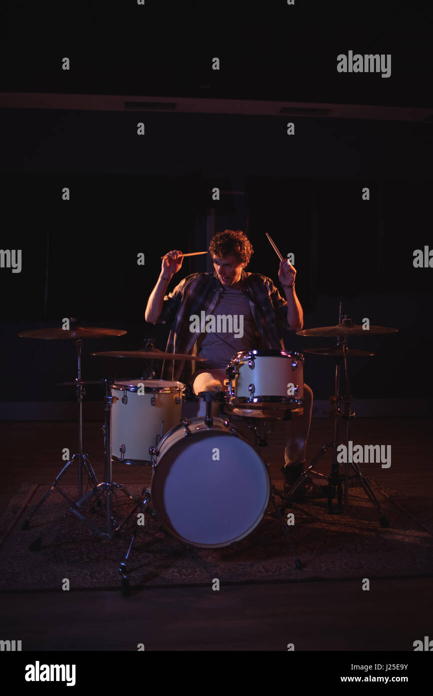 Drummer playing on drum set in recording studio Stock Photo - Alamy