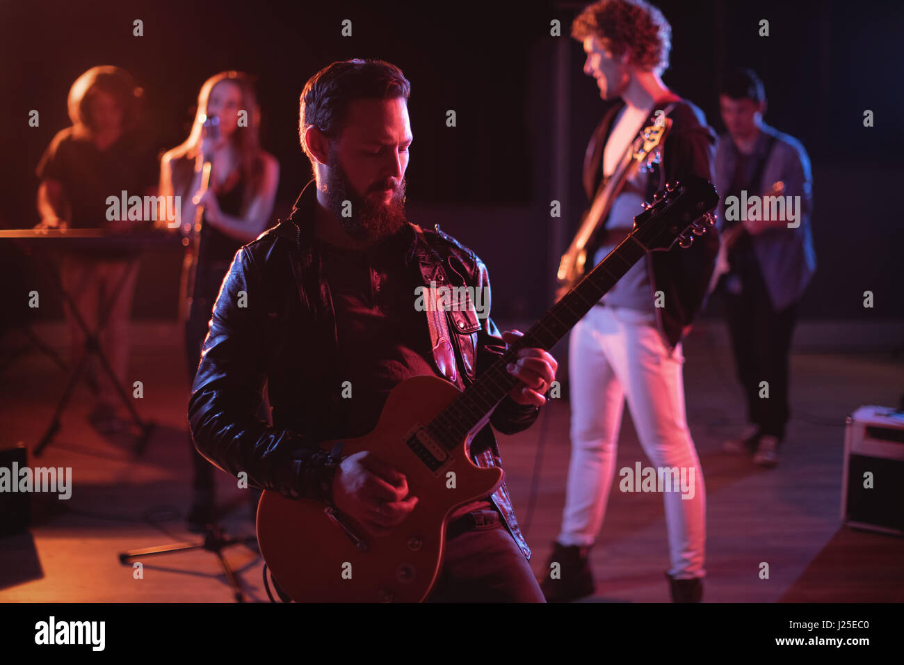 Band performing in recording studio Stock Photo - Alamy