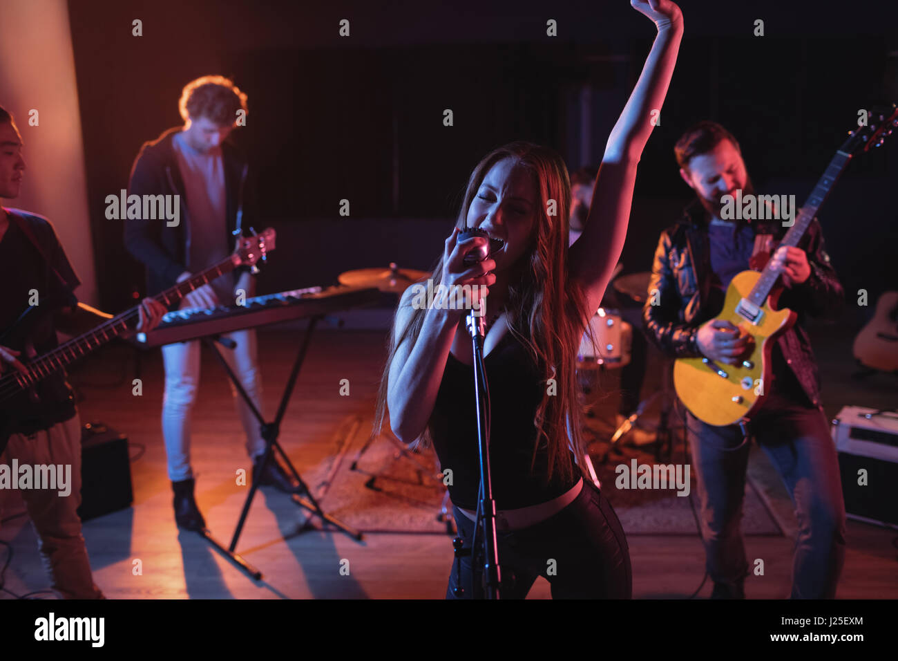 Band performing in recording studio Stock Photo - Alamy