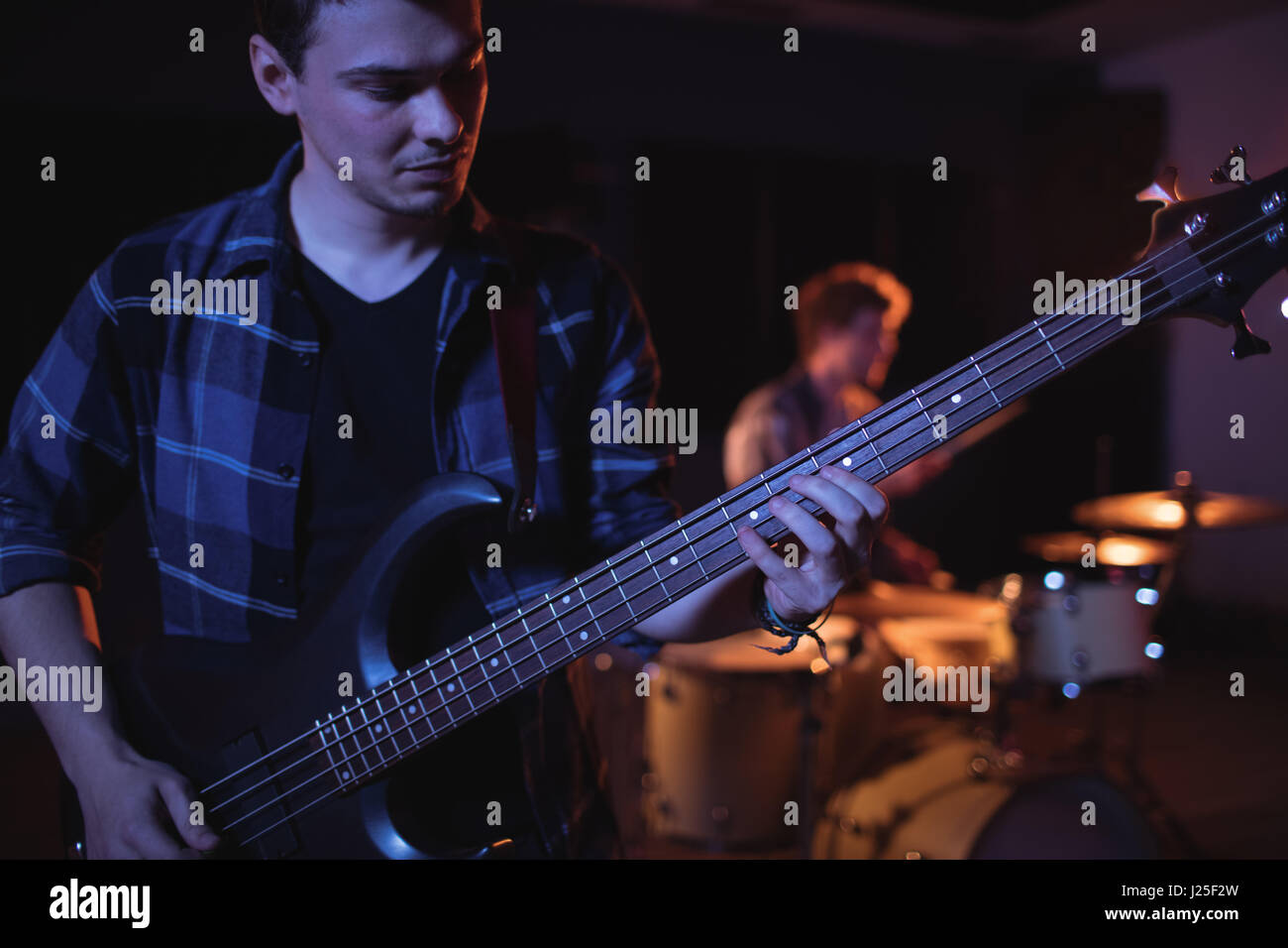 Guitarist playing electric guitar in recording studio Stock Photo - Alamy