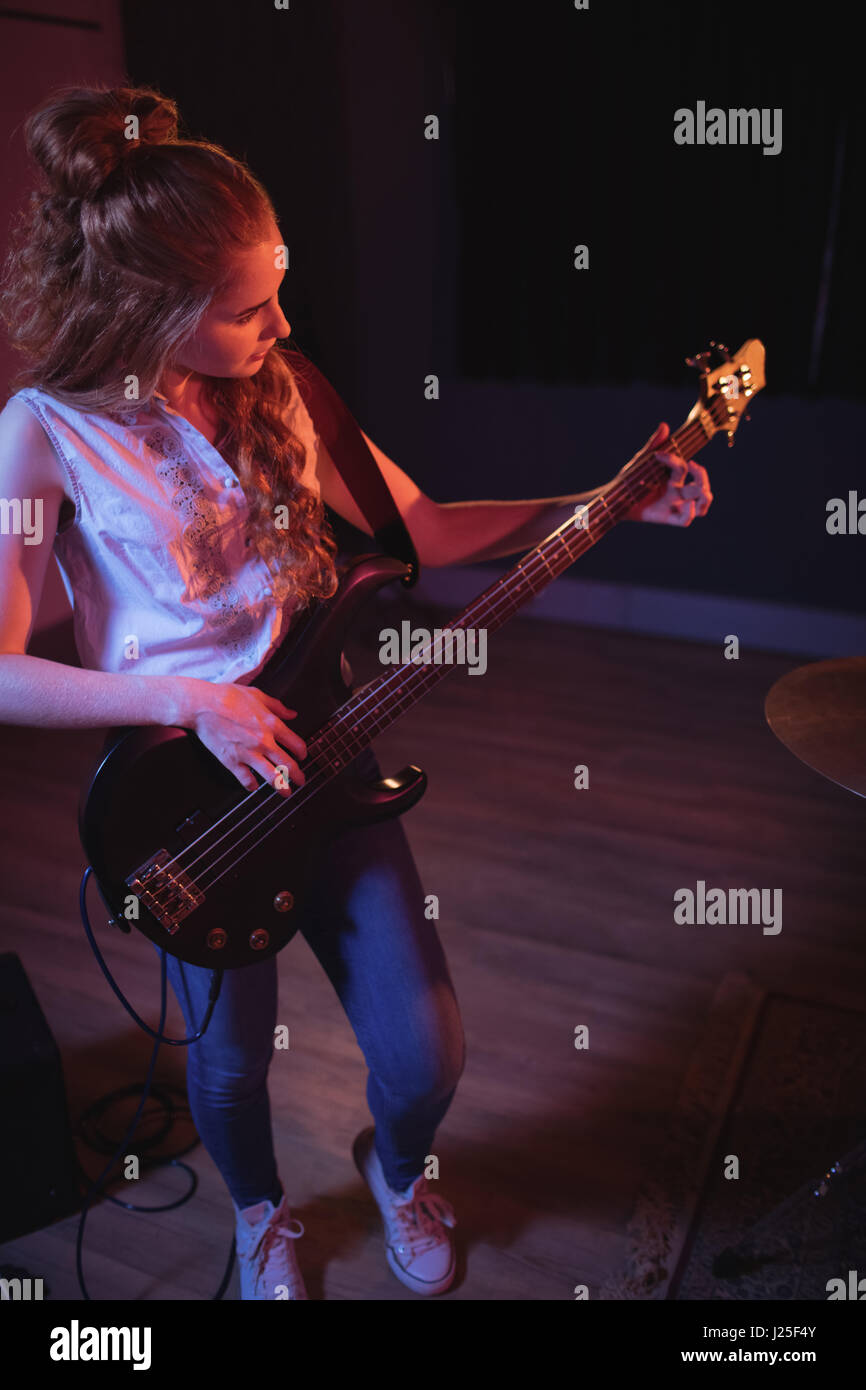 Musician playing electronic guitar in recording studio Stock Photo - Alamy