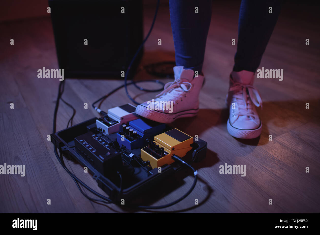 Low section of musician using loop station Stock Photo - Alamy