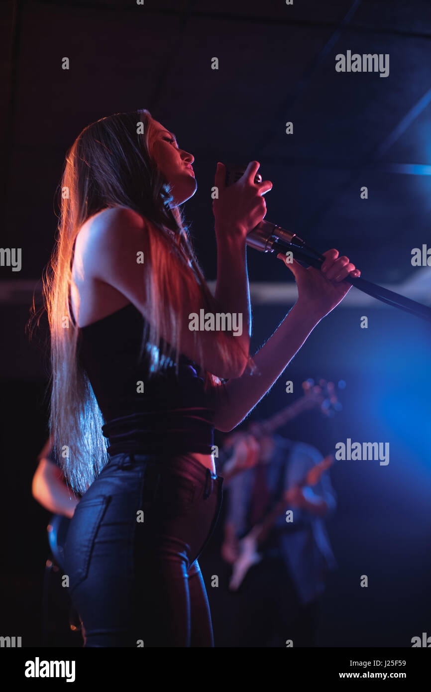 Female singer singing in recording studio Stock Photo - Alamy