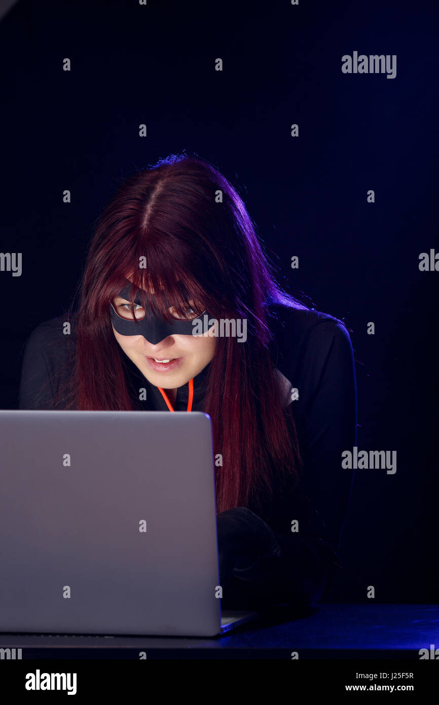 Female thief in black mask hi-res stock photography and images - Alamy