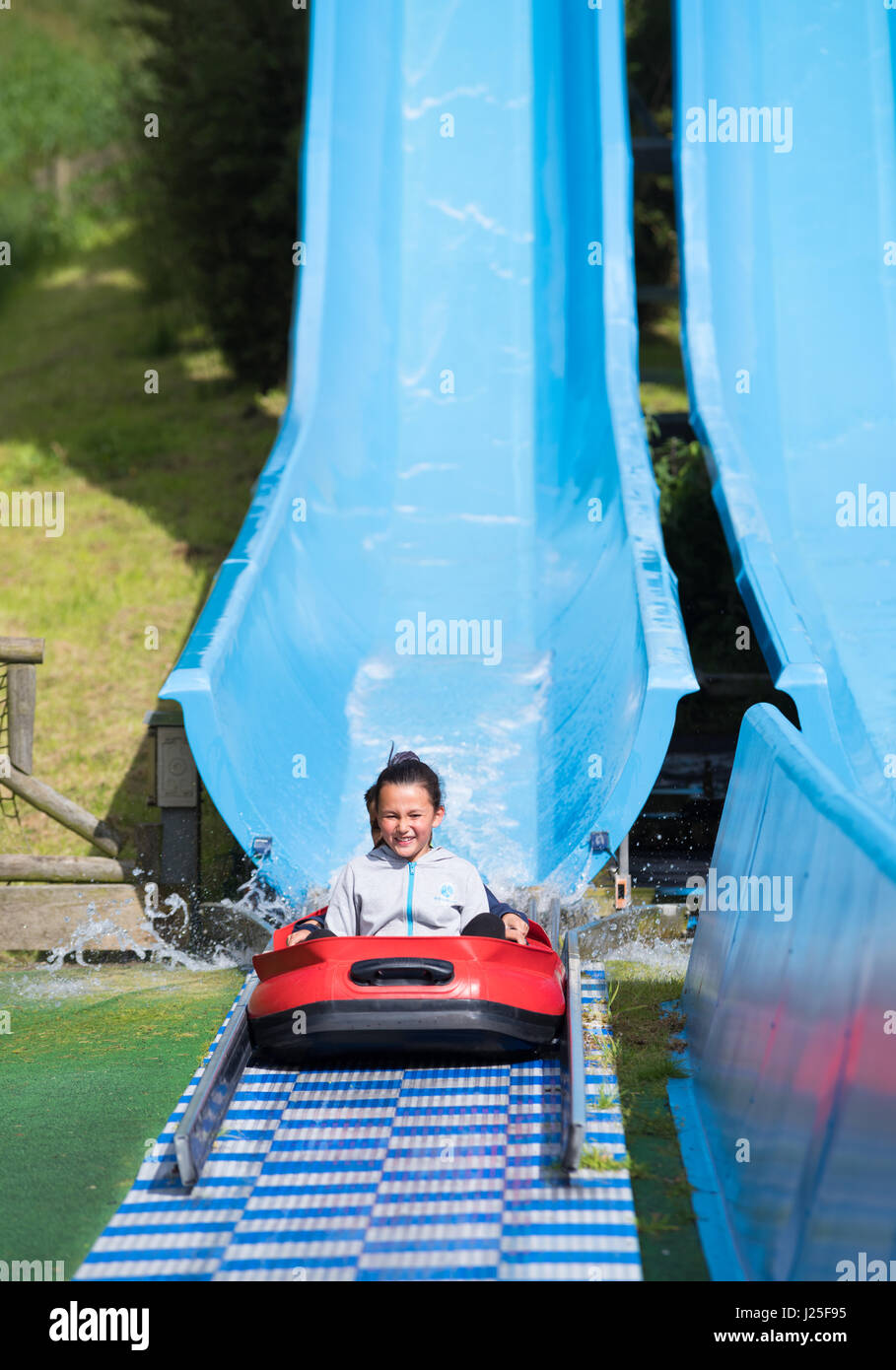 Girl water slide hi-res stock photography and images - Alamy