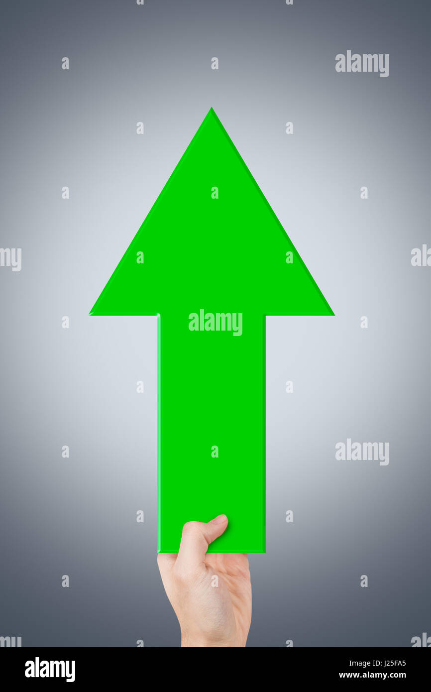 Illustrative abstract view of green arrow sign to up direction, holding ...