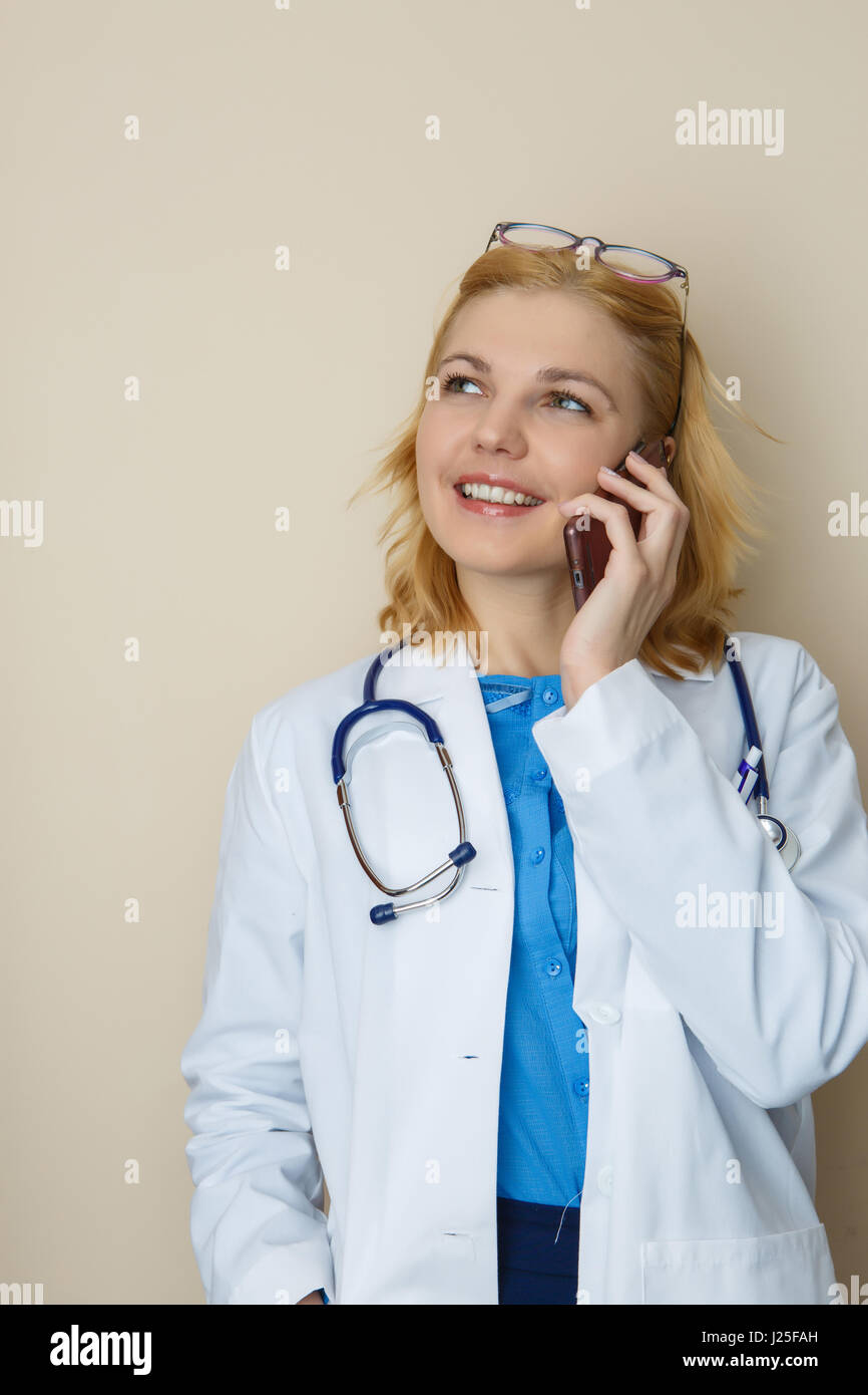 Blonde in robe with phone Stock Photo - Alamy