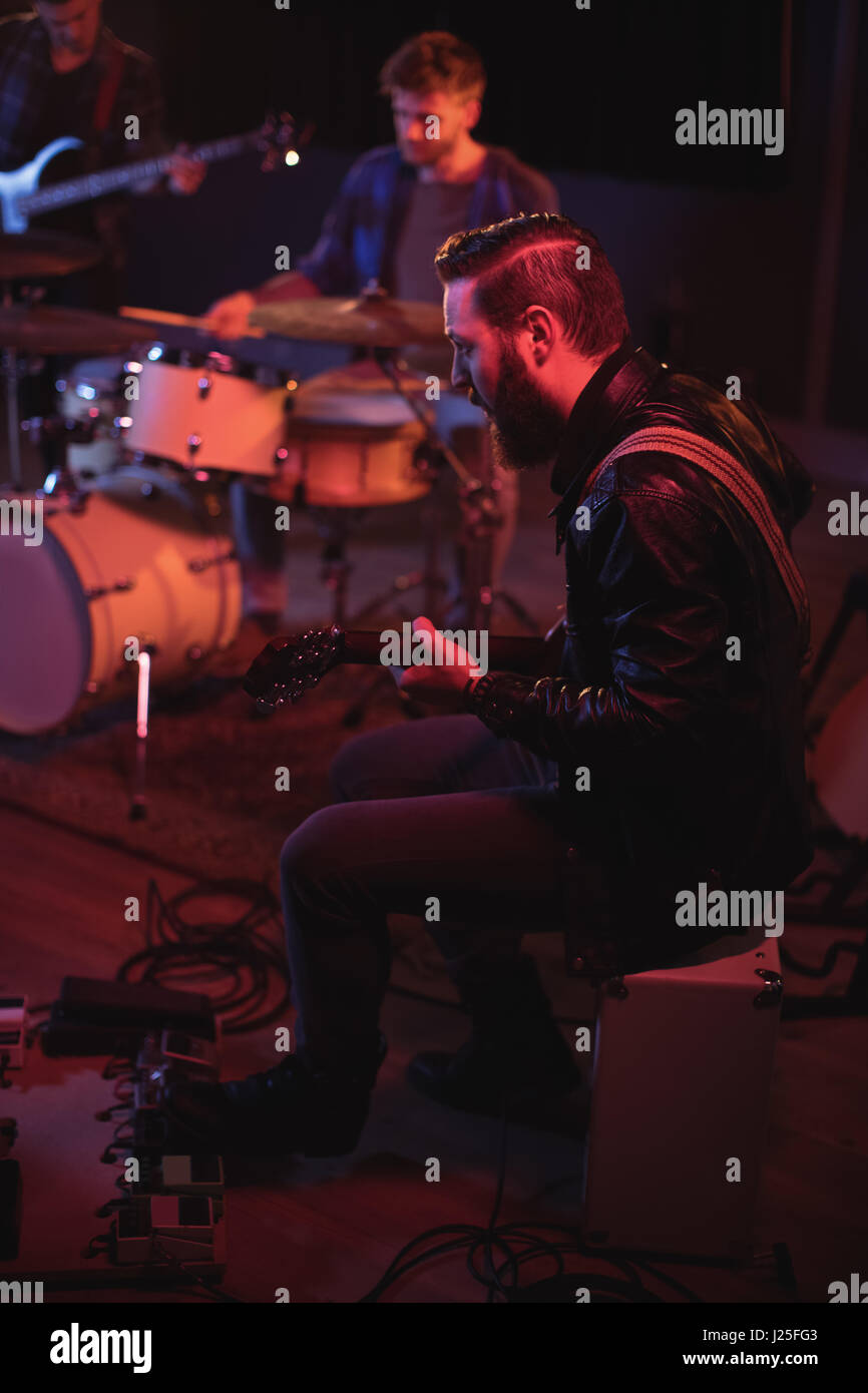 Band performing in recording studio Stock Photo - Alamy