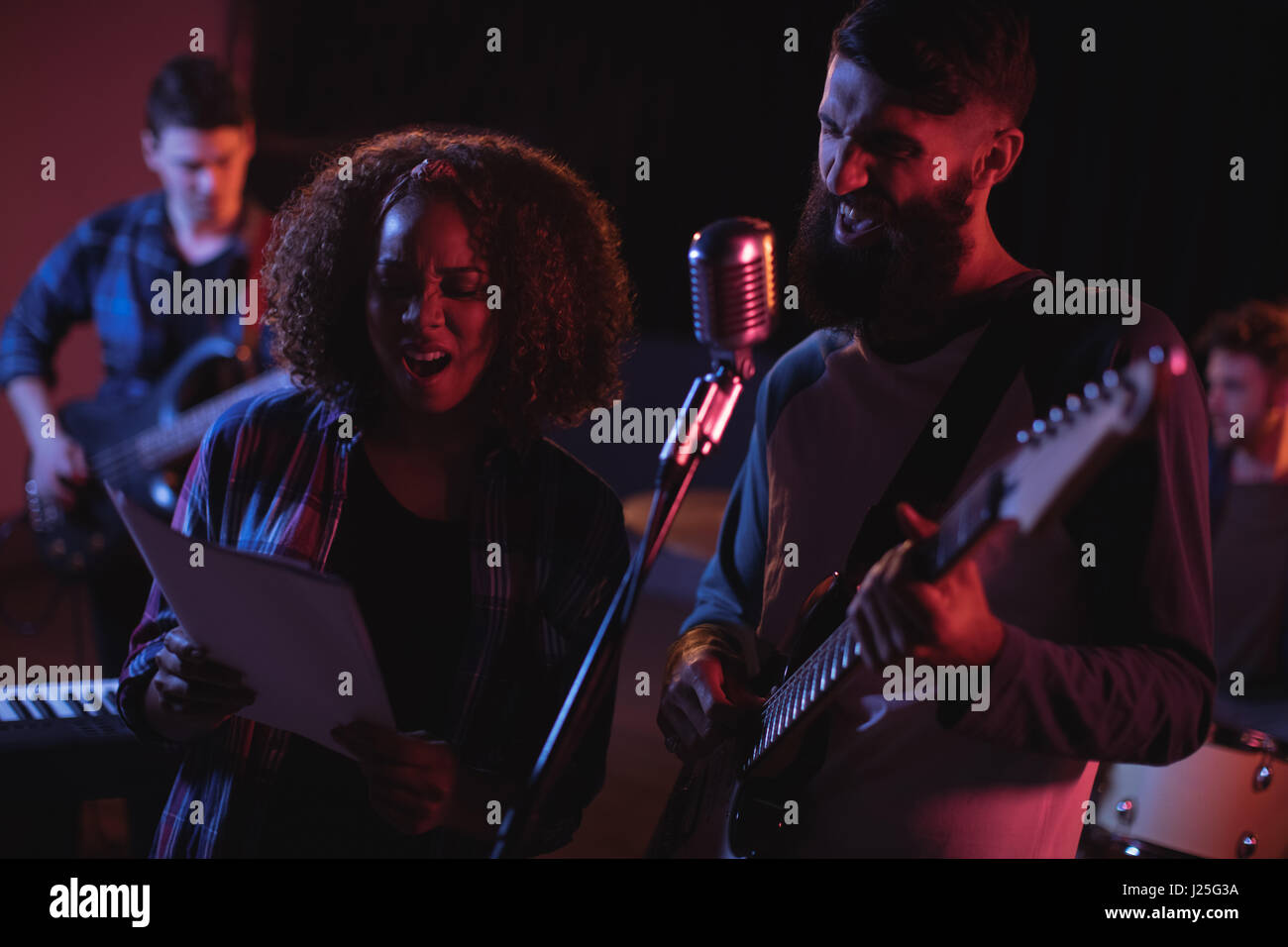 Singers singing in recording studio Stock Photo - Alamy