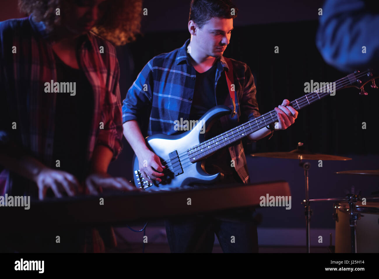 Musician playing electronic guitar in recording studio Stock Photo - Alamy